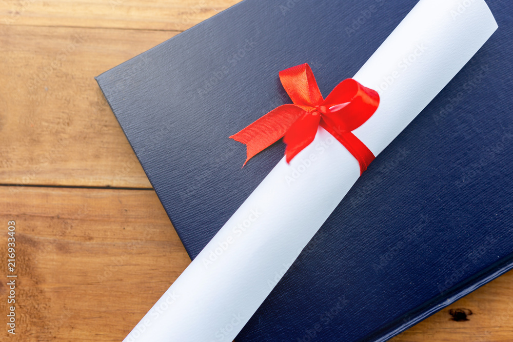 Congratulations for graduation.mortarboard and graduation scroll,tied ...