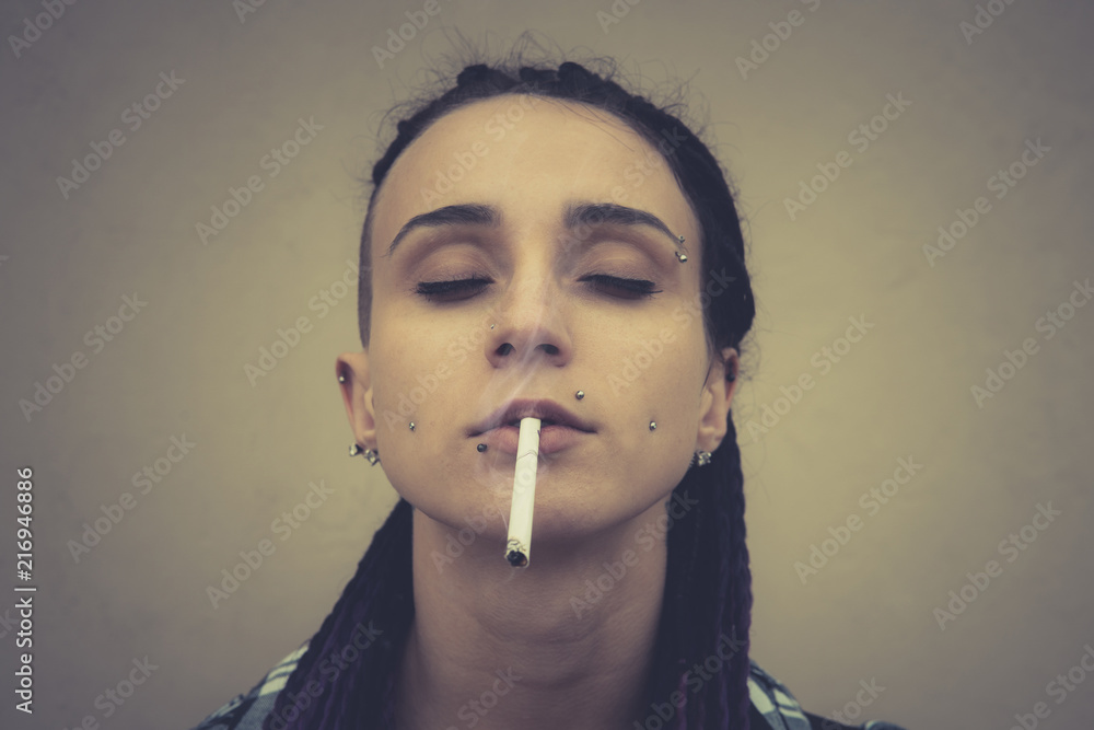 Beautiful Young Grunge Rock Girl Smoking Cigarette Outdoor Portrait Of Informal Model A Woman