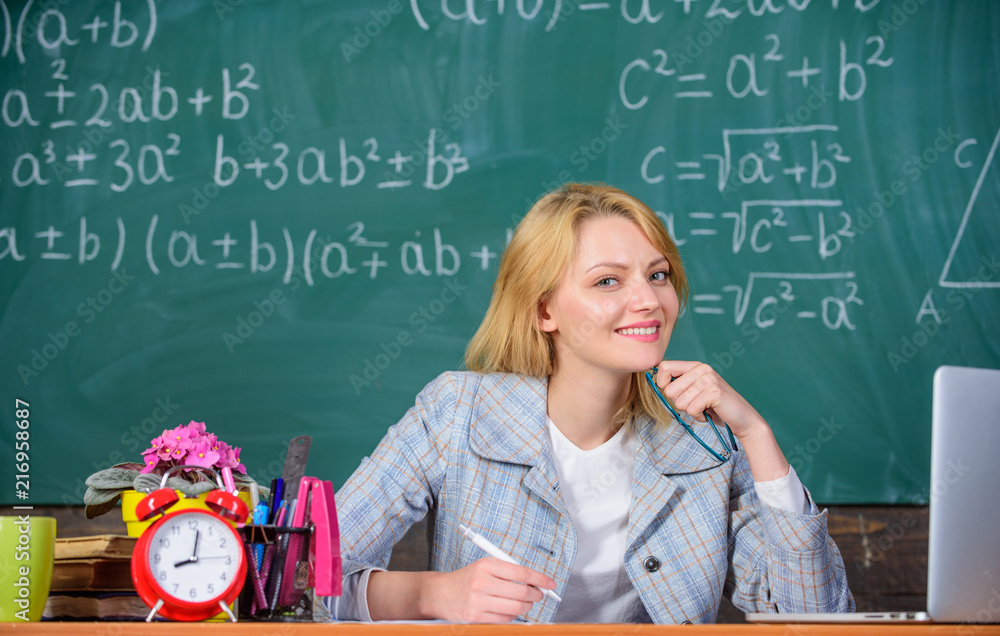 Teacher woman sit table chalkboard background. Organize class and make ...