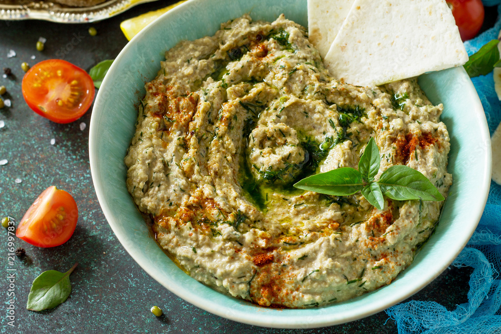 Arabic cuisine. Fresh homemade creamy mung hummus close-up on a stone ...