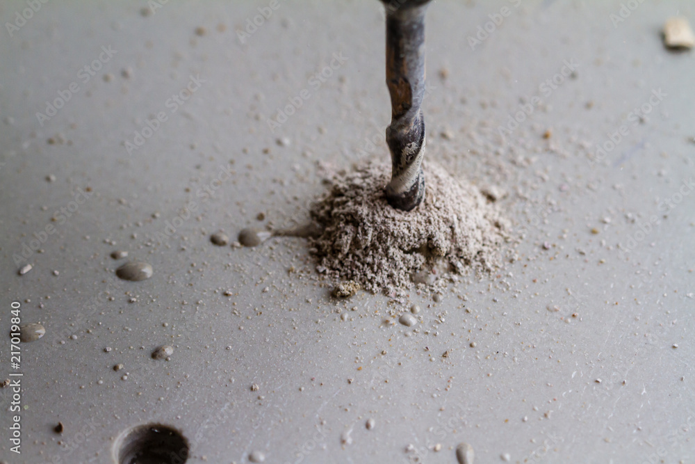 Dust from Drilling drill on tiles ground Stock Photo | Adobe Stock