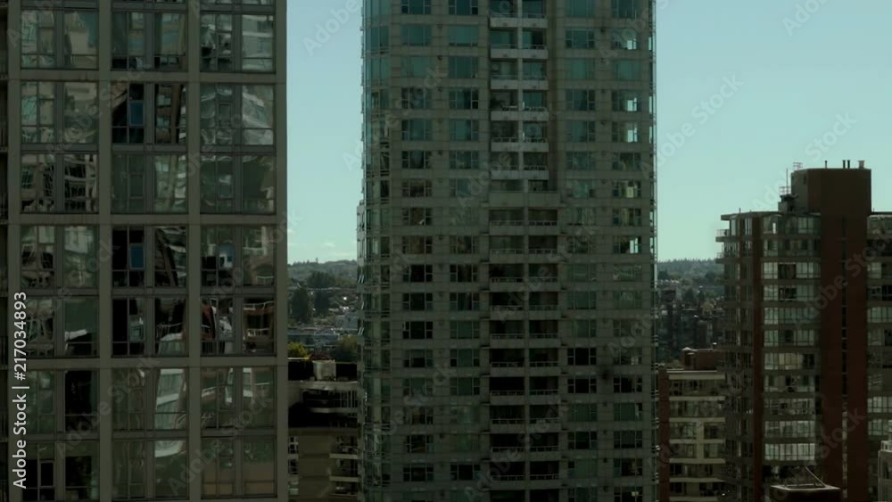 Slow Panning Shot of Tall Buildings in Vancouver BC, Canada as Birds ...