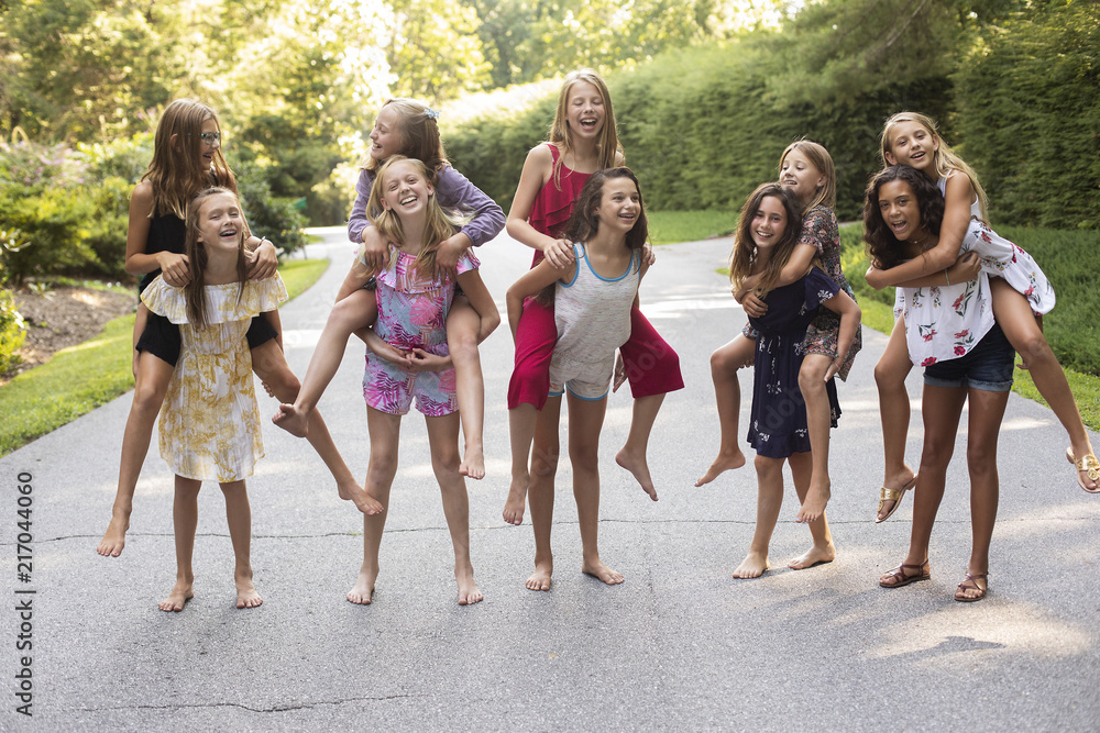 Tween Friends, Girls, in line on Piggy Back Stock Photo | Adobe Stock