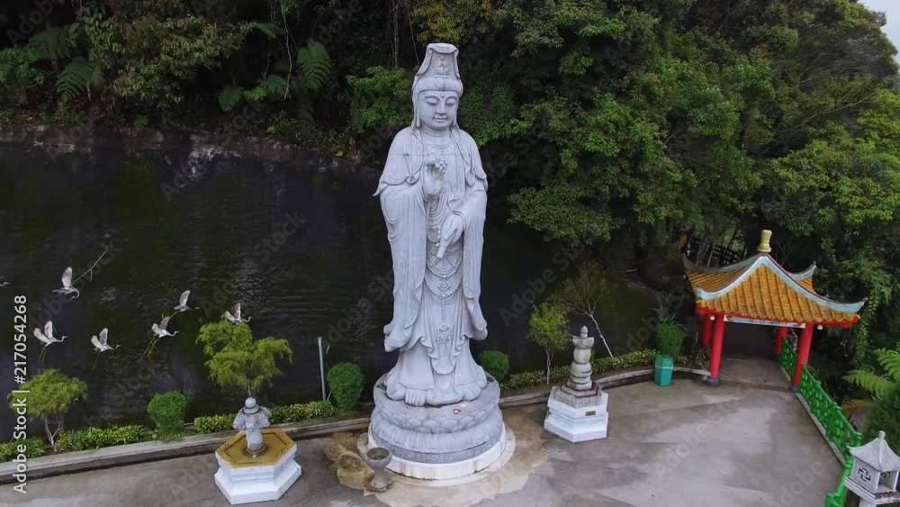 Drone shot circling the Kuan Yin statue at popular tourist attraction ...