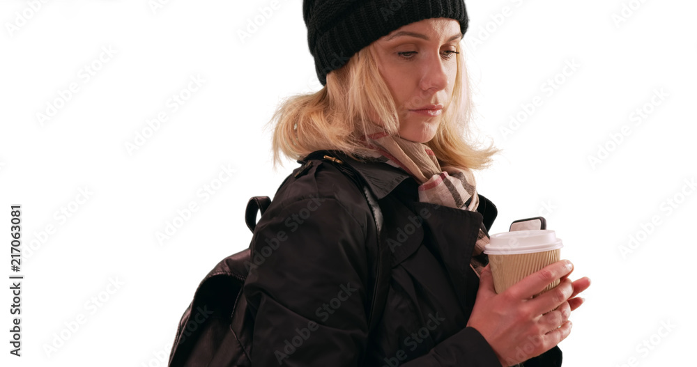 Nonchalant Caucasian female staring with sad expression on solid white ...