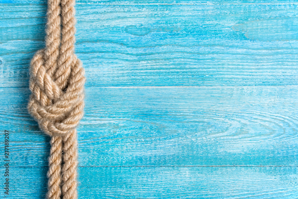 Rope, knot and background wood Stock Photo | Adobe Stock