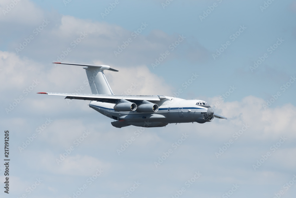 Four-engine heavy cargo plane in the sky. The plane to extinguish fires ...