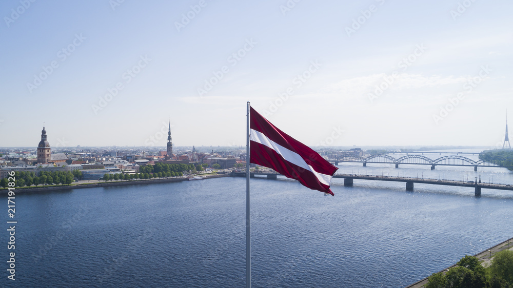 Panorama of Riga city with a big Latvian flag in foreground Stock Photo ...