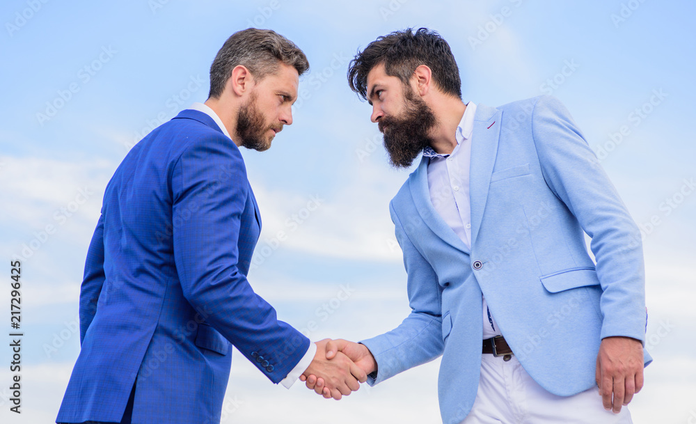 Entrepreneurs shaking hands symbol successful deal. Sure sign you ...