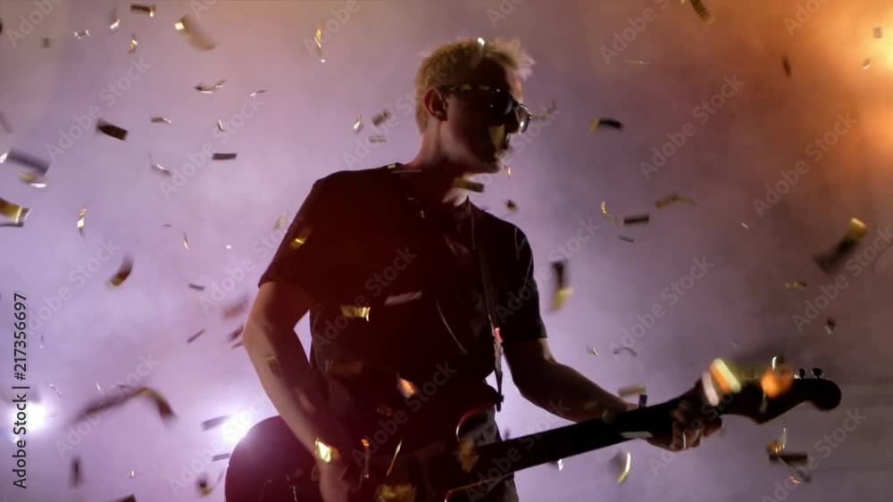 Concert rock band performing on stage with singer guitar. Music video ...