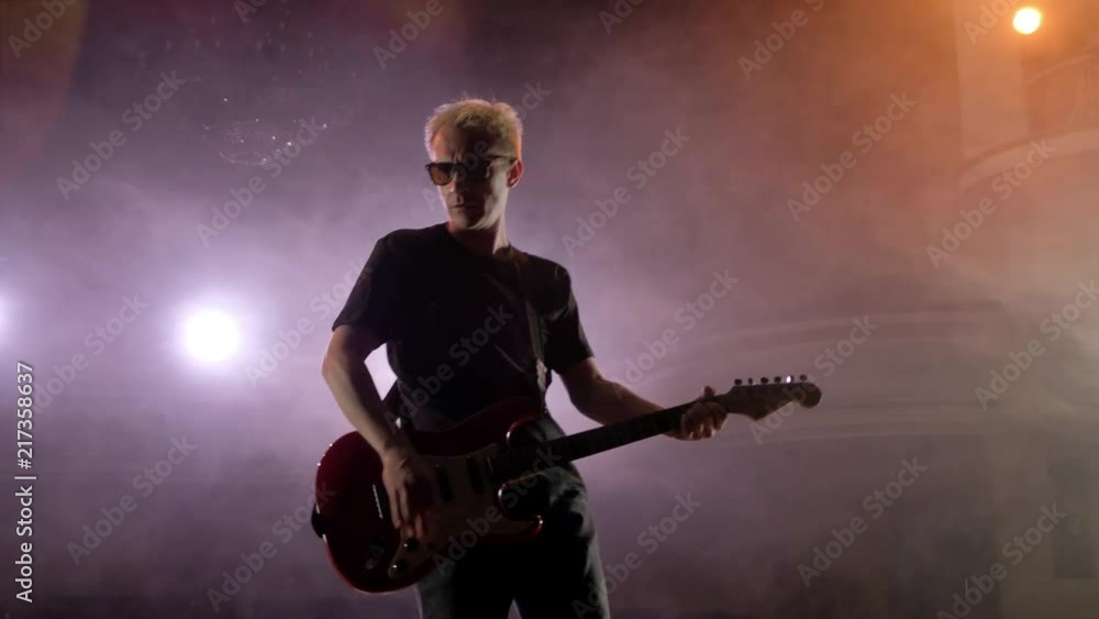 Concert rock band performing on stage with singer guitar. Music video ...