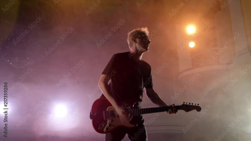 Vídeo do Stock: Concert rock band performing on stage with singer ...