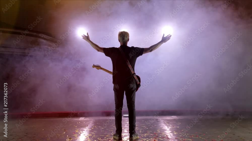 Concert rock band performing on stage with singer guitar. Music video ...