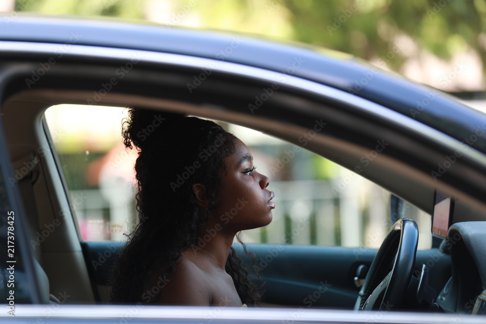 Confident black woman driving car Stock Photo | Adobe Stock