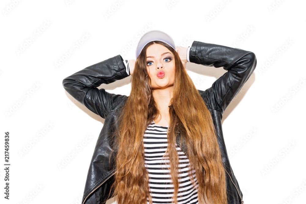 Blue eyed teenage girl posing, making kissy face, with hands on her ...