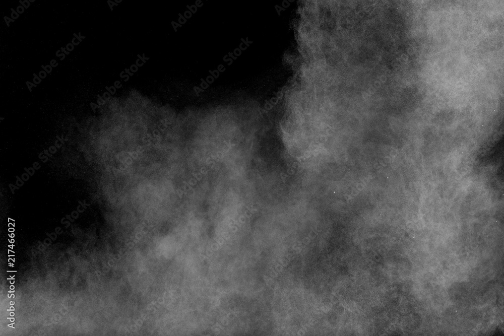 Bizarre forms of white powder explosion cloud against black background ...