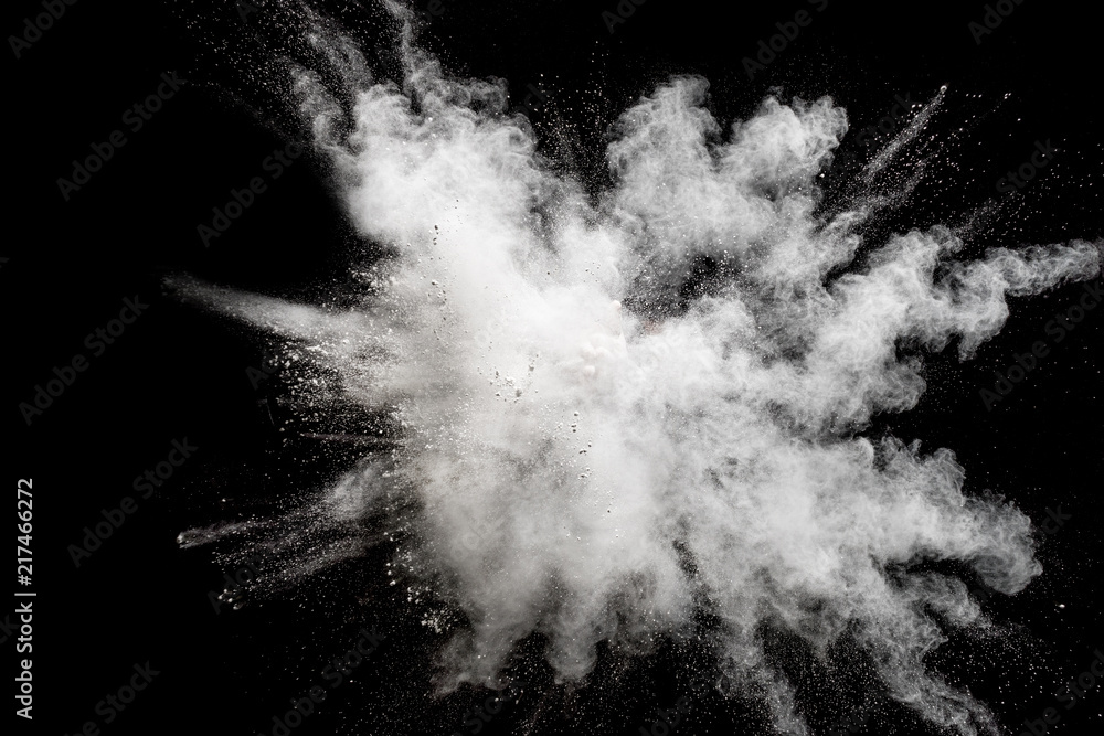 Bizarre forms of white powder explosion cloud against black background ...