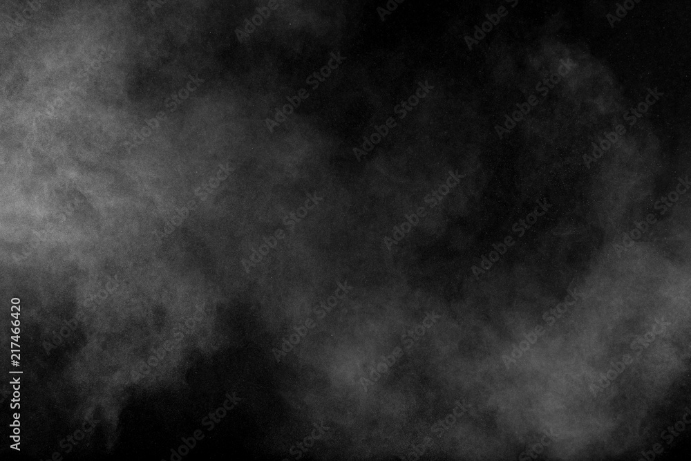 Bizarre forms of white powder explosion cloud against black background ...
