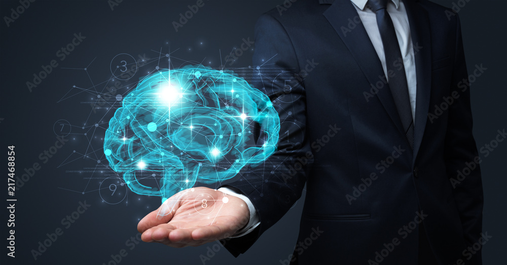 Businessman holding human brain on his hand with logistics symbols ...