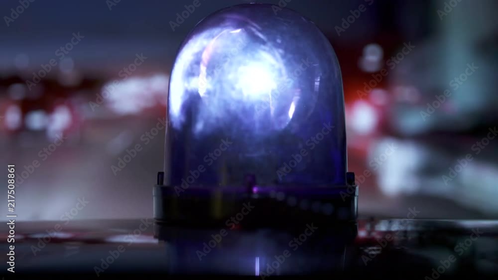 POV driving vehicle with blue flash emergency light on highway at night ...