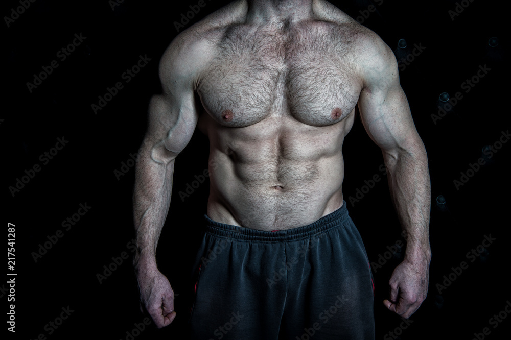Perfect look. Torso with six packs looks attractive on black background ...