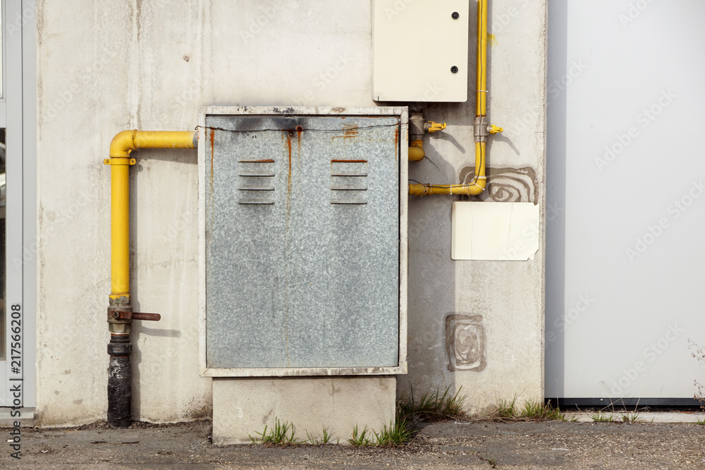 Industrial gas meter yellow box and pipes Stock Photo | Adobe Stock