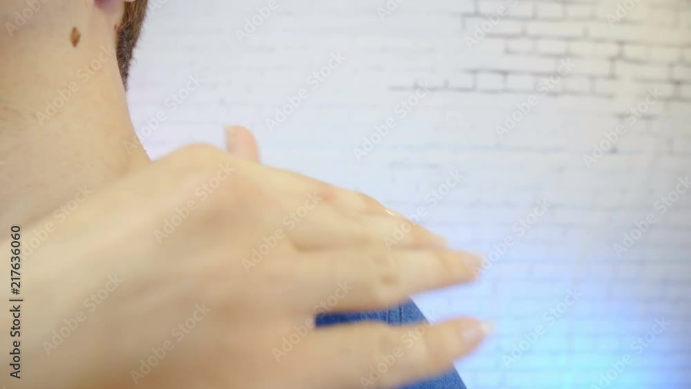 Brush dust from shoulder close-up 4K. Long shot of person's shoulder in ...