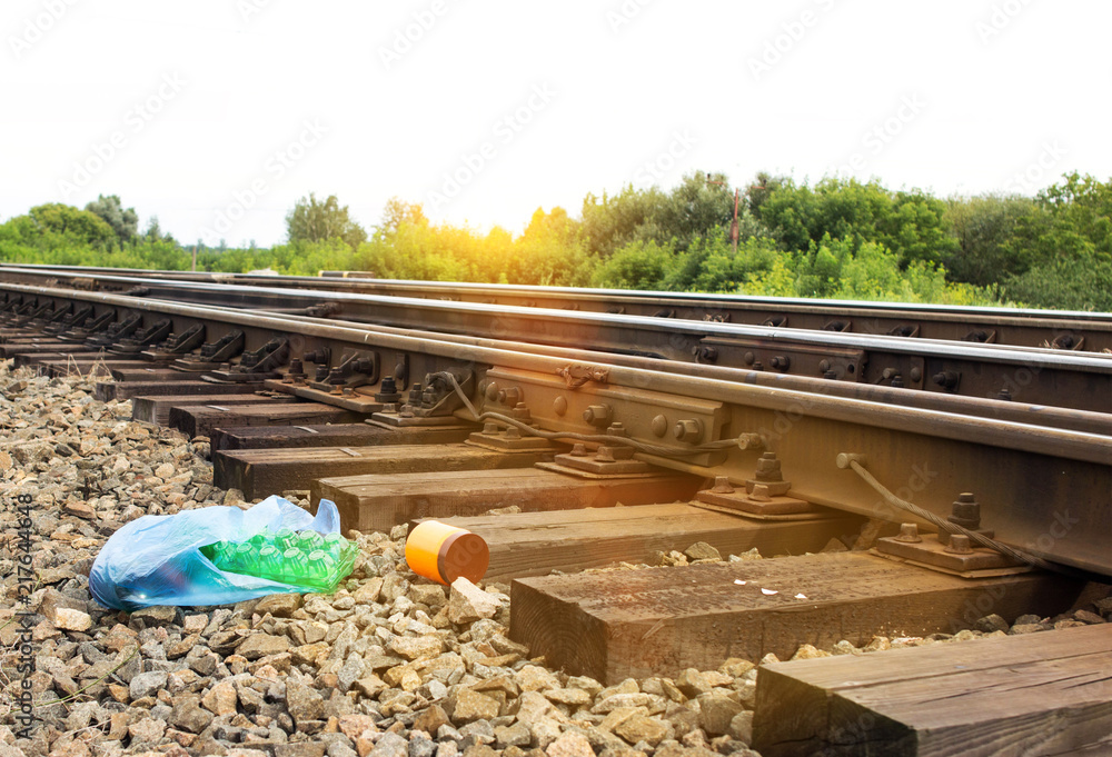 A package with garbage on the railway thrown out from the window of the ...