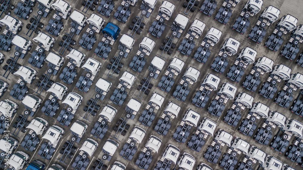 Aerial top view of white cargo trailer parking, trailer line up for ...