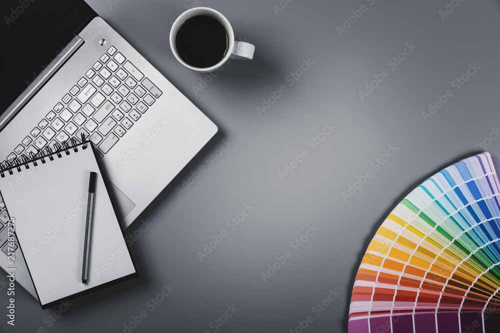 designer workplace with color palette and laptop. top view with copy ...