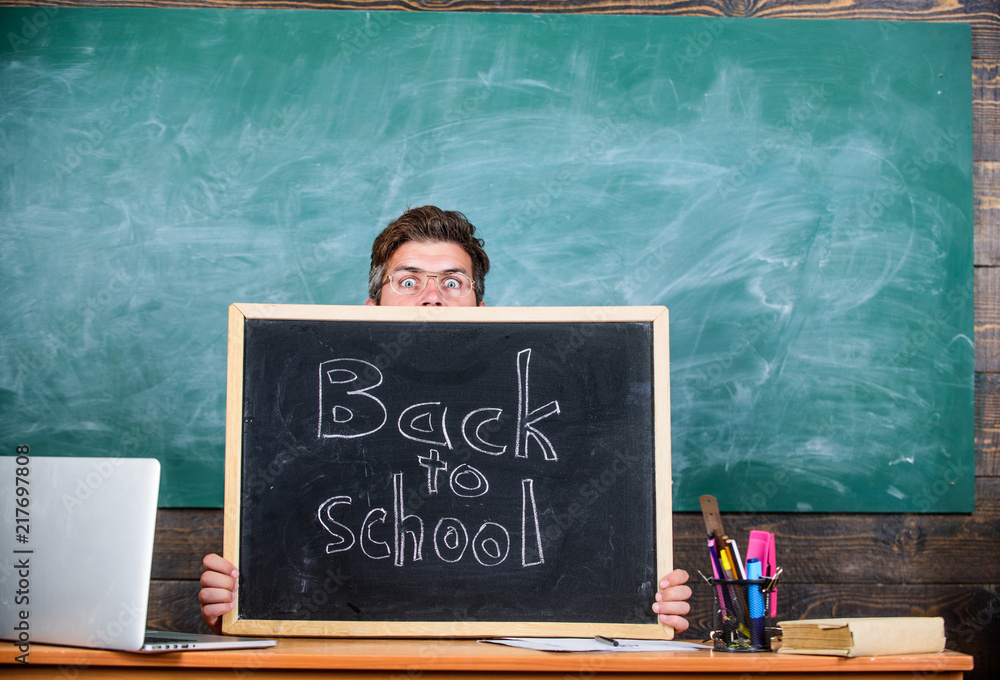 Teacher or school principal welcomes inscription back to school ...