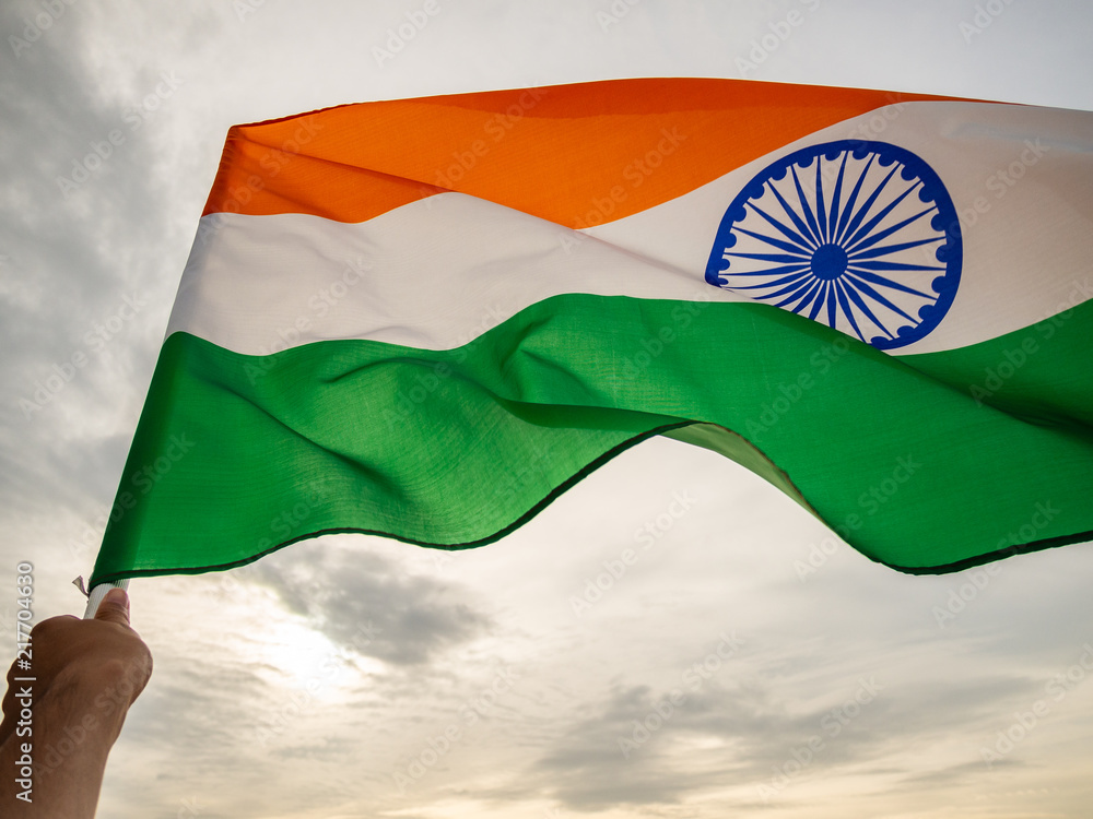 The wavy Indian flag on the sunset sky. Indian independence day. Stock ...