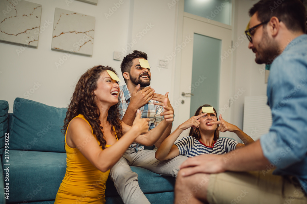 Group of friends are playing social games. Young friends are playing ...