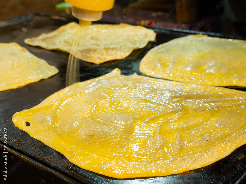Street food - Roti canai,famous Asian pancake. The making of roti canai ...