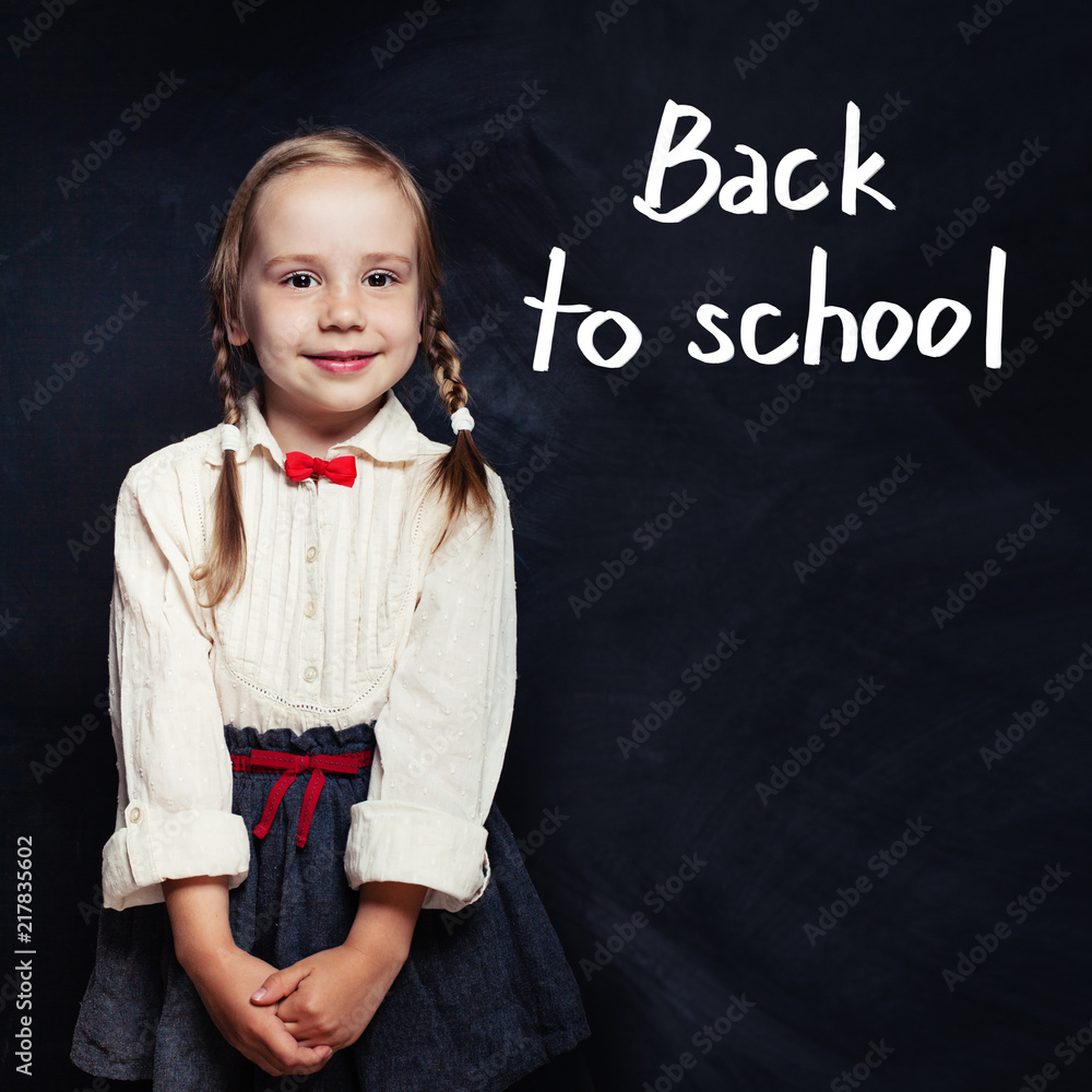 Foto Stock Cute child little girl in school uniform clothes on chalk ...