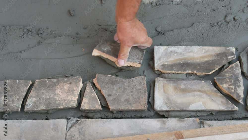 Old tiles recycling, making terrace or pavement using tile pieces ...