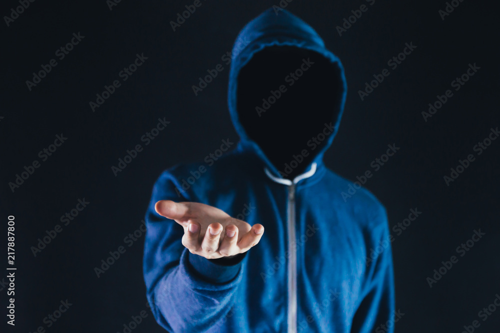 Anonymous and faceless man under hoodie giving a helping hand isolated ...