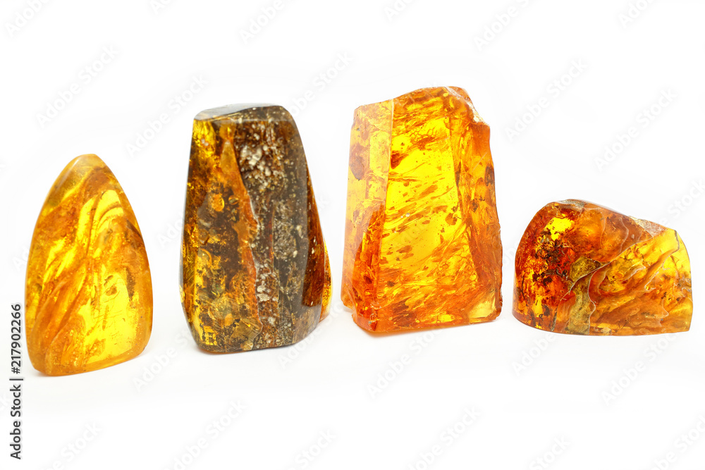 Amber. Beautiful bright transparent pieces of amber of different shapes ...