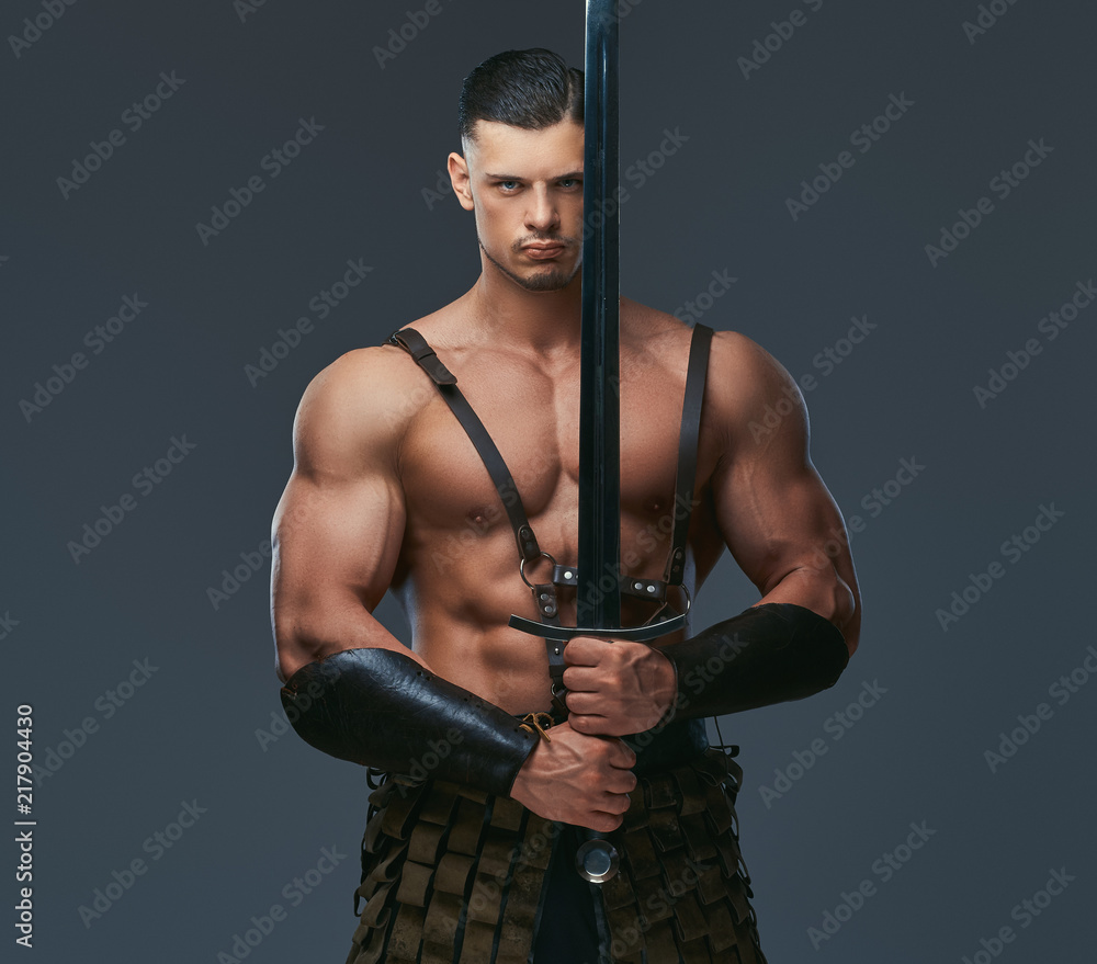 Brutal ancient Greece warrior with a muscular body in battle uniforms ...