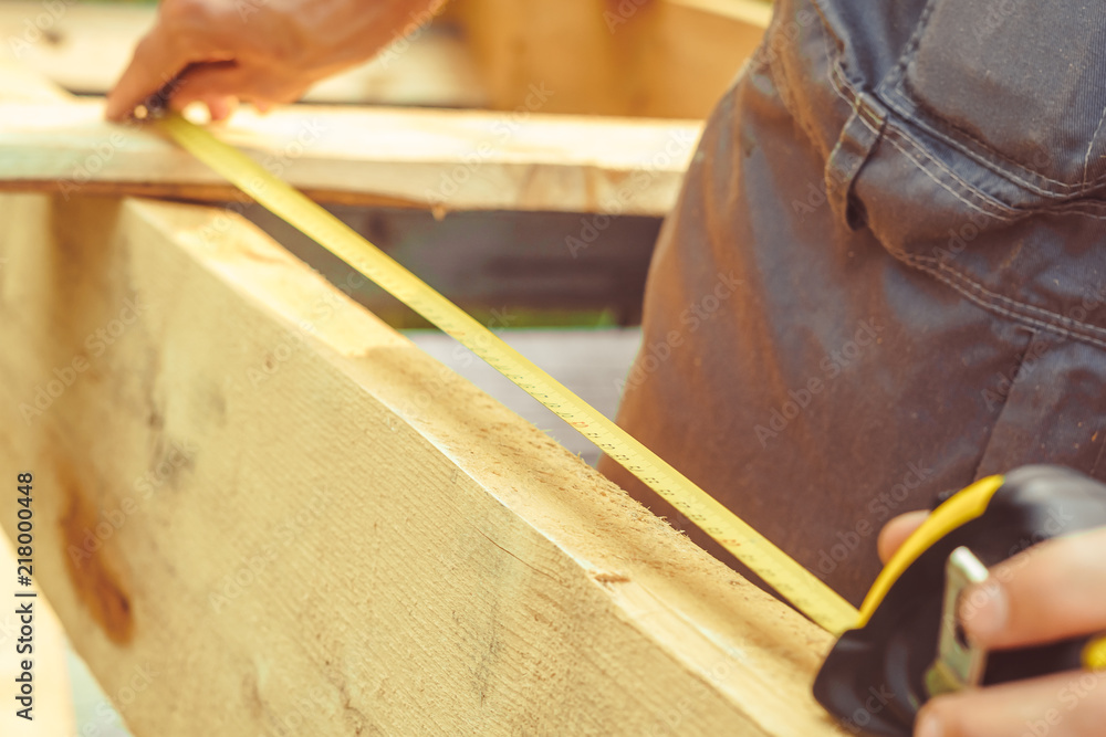 Poster the worker makes measurements with a tape measure – Wall Art ...