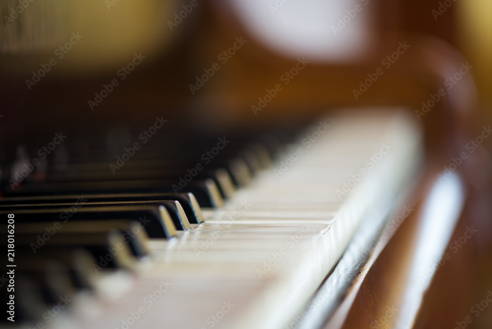 Macro shot of the keyboard of an old out of tune rustic piano. Ivory ...