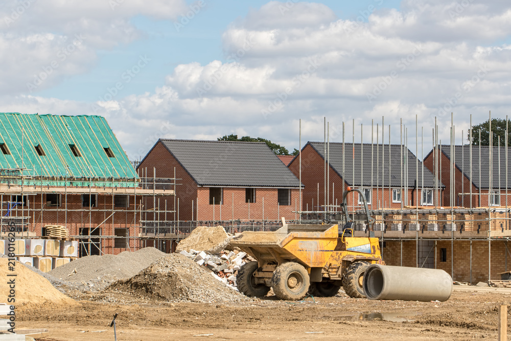 Construction industry building site. Houses at various stages of ...