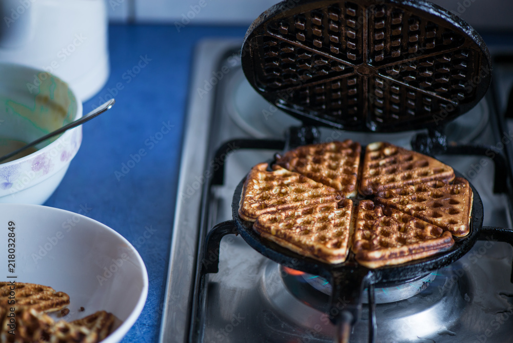 Just cooked, delicious, tasty, hot yogurt pancakes on waffle iron on ...