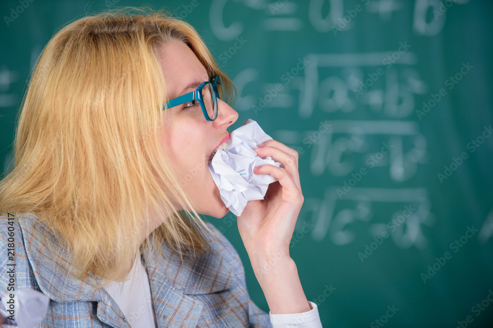 Teacher ready to eat her paperwork. Teacher eats piece of paper absorb ...