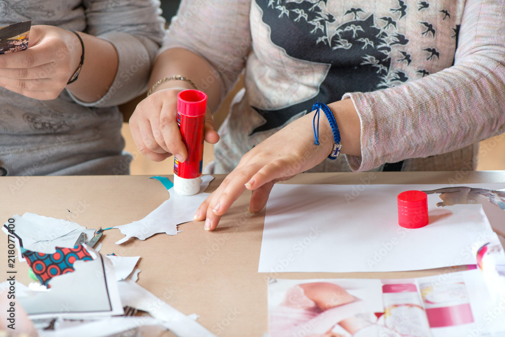 Stockfoto Creative workshop for kids. Little girls gluing cut out ...