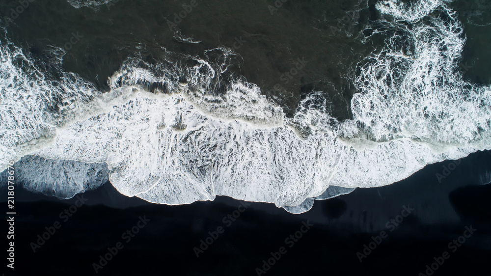 The black sand beach in Iceland. Sea aerial view and top view. Amazing ...