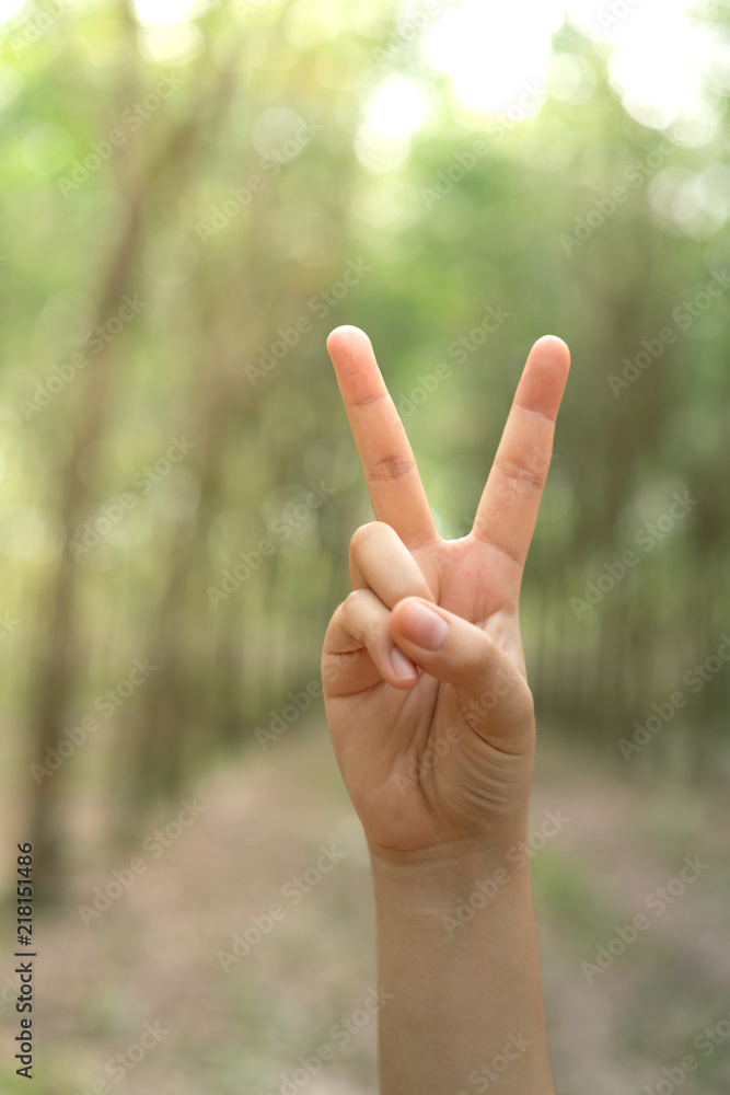 Two fingers with blur background body language sign V sign. Stock Photo ...