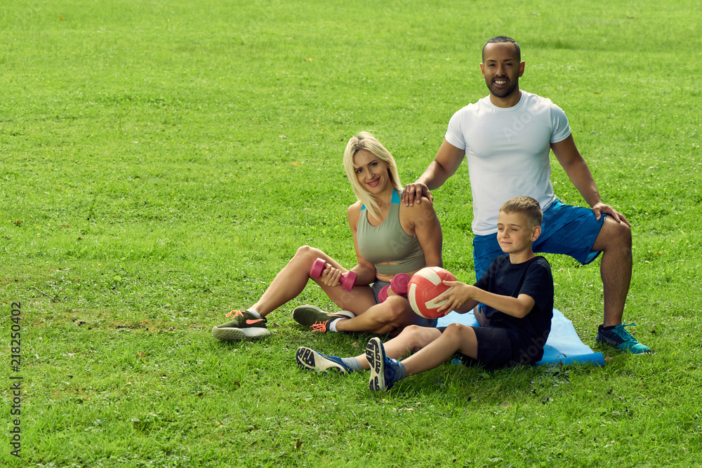 Sports multinational family; mother, father and his son doing sport ...