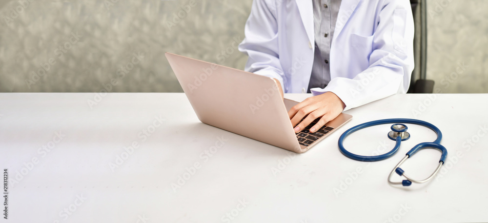 Smiling doctor posing in the office, She is wearing a stethoscope ...