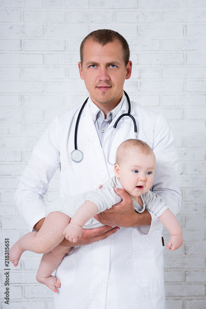 pediatry concept - doctor pediatrician holding little baby patient ...
